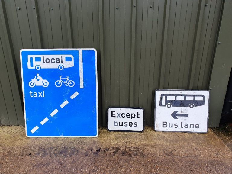 Signs – “Large Blue Bus, Bike, Motorbike, Taxi” “Except Buses ...